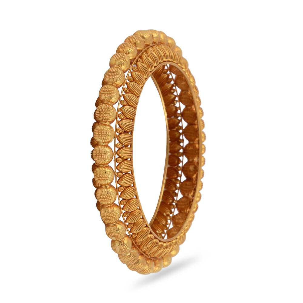 Buy Modest Embossed Gold Bangle at Best Price | Tanishq US