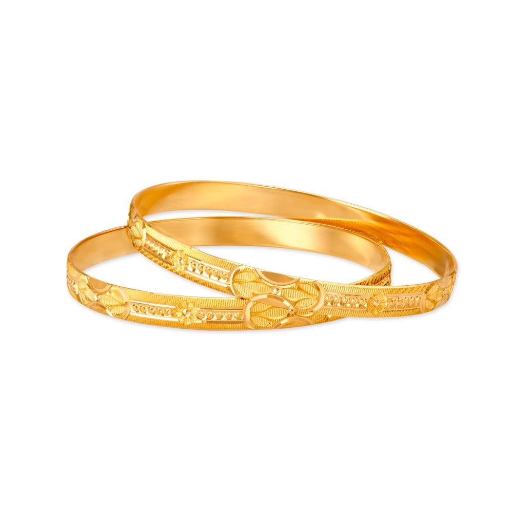 Buy Winsome Yellow Gold Floral Etched Bangles at Best Price | Tanishq UAE